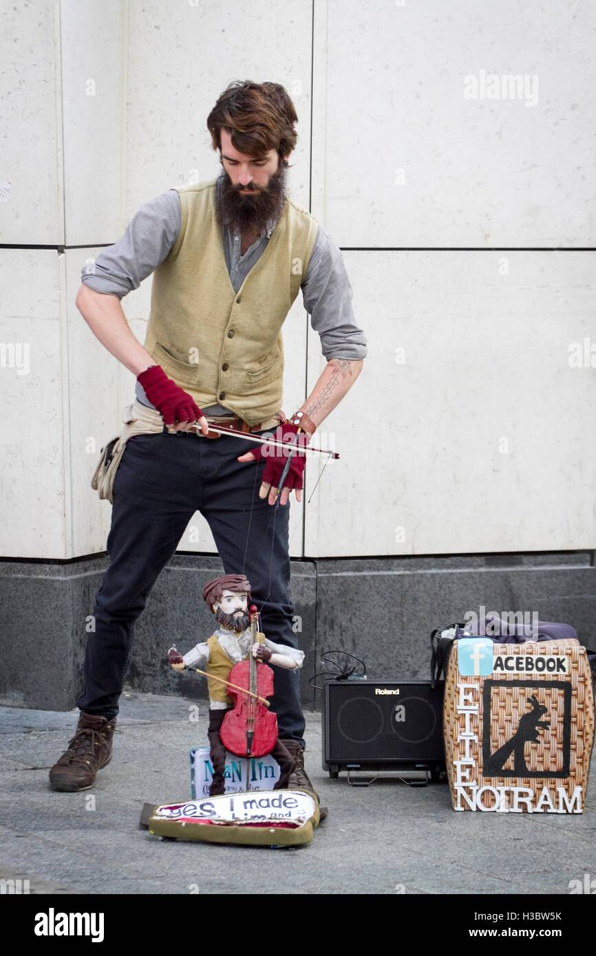 Street busker on pavement in Liverpool, Merseyside, UK Stock Photo - Alamy