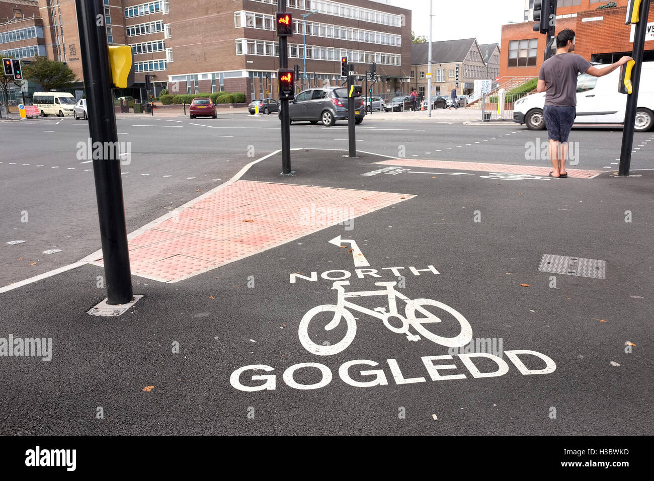 Pavements in Cardiff with cycle routes painted in both English and ...