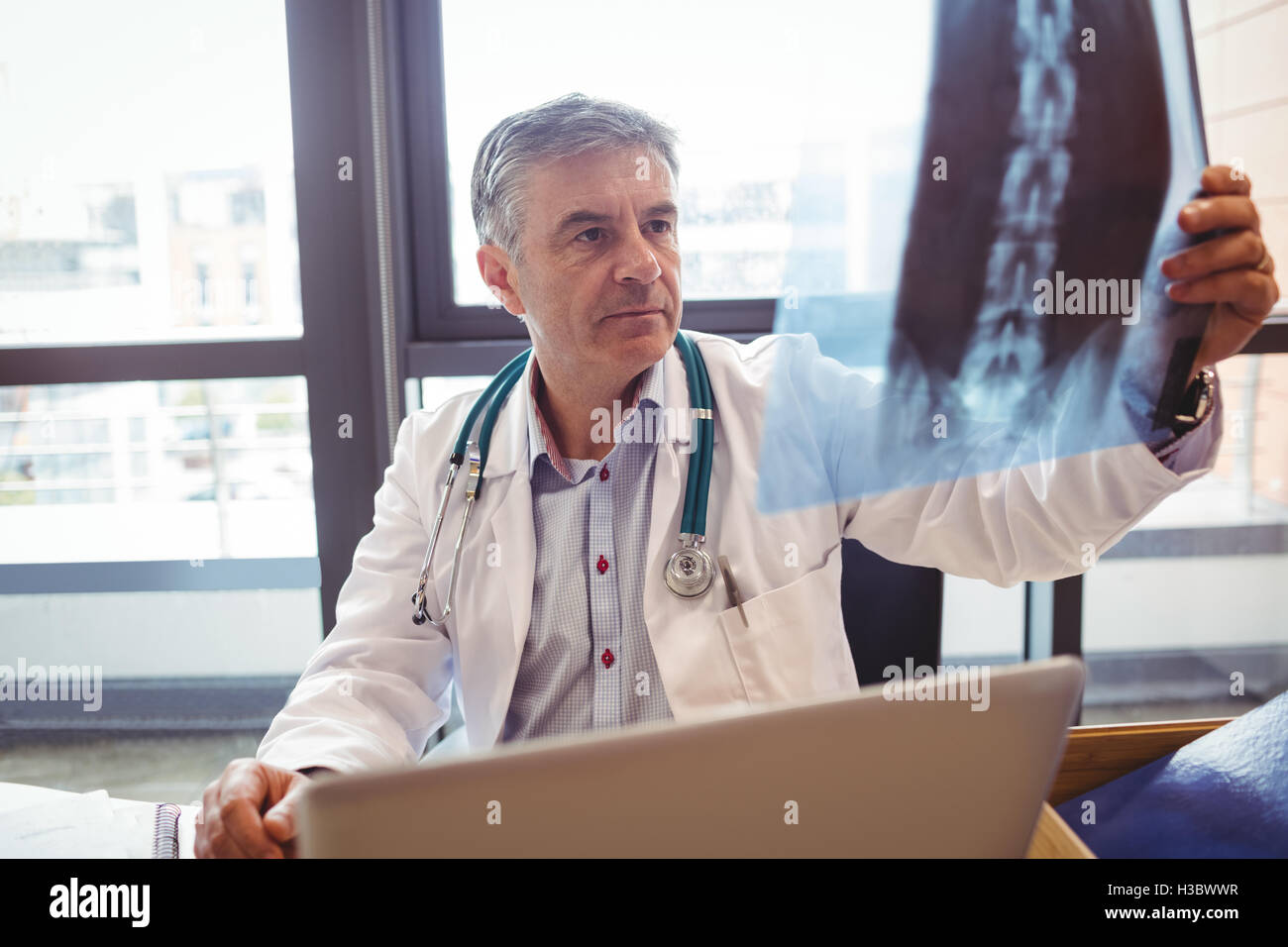 Doctor examining x-ray Stock Photo - Alamy
