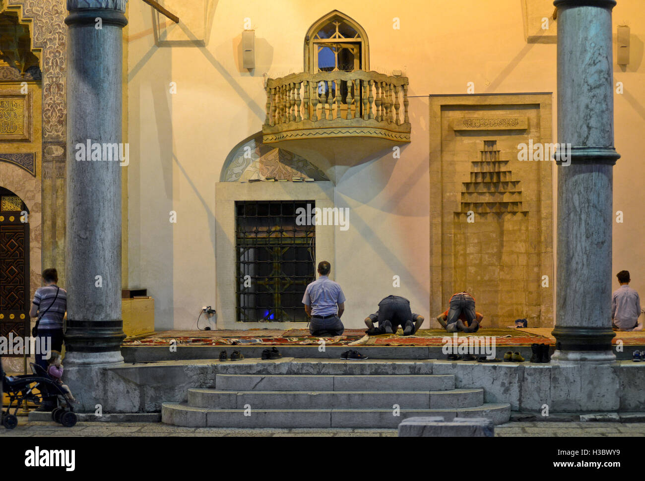 Muslim men praying during Ramadan in the Gazi Husrev-beg Mosque ...