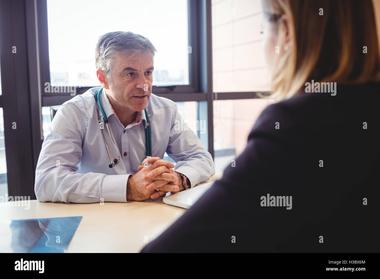 Doctor sitting chair hi-res stock photography and images - Alamy