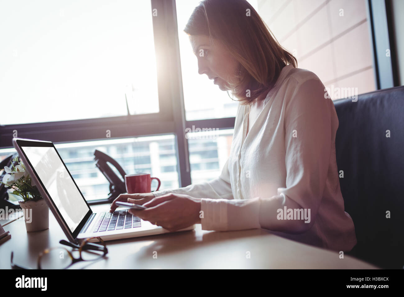 Professional laptop and phone hi-res stock photography and images - Alamy