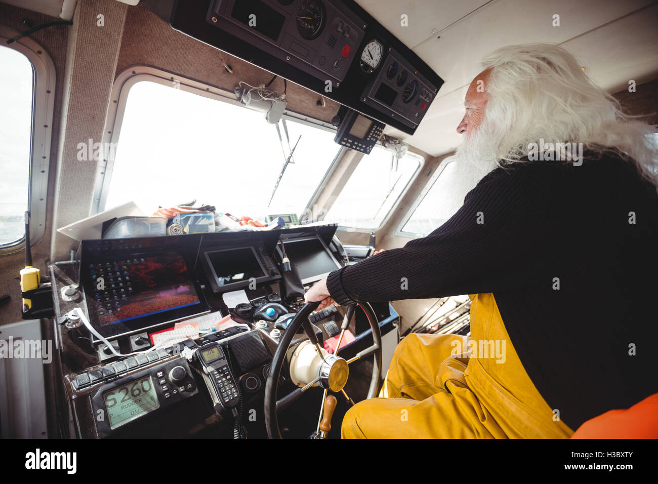 Driving the boat hi-res stock photography and images - Alamy