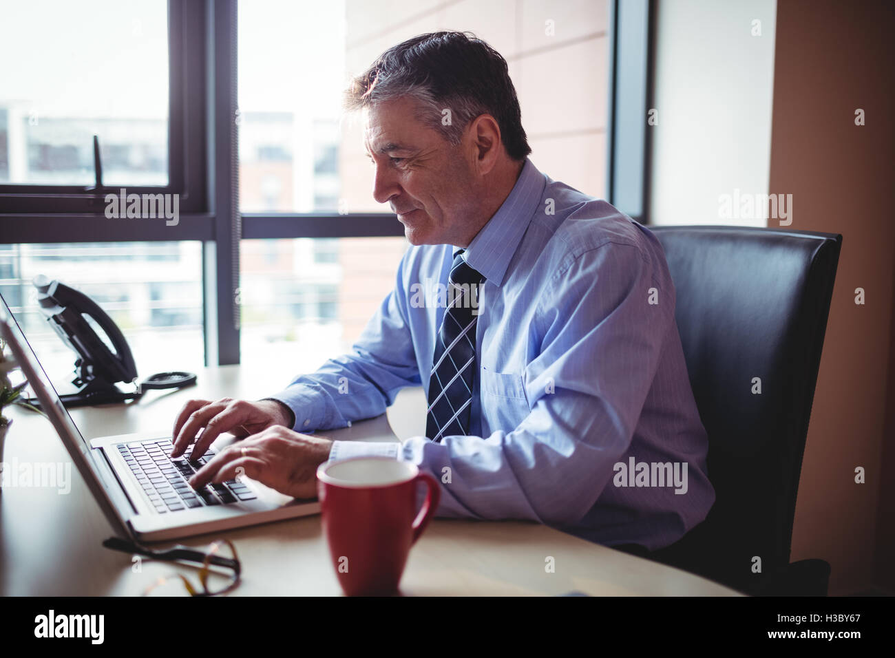 Stylish businessman working laptop hi-res stock photography and images ...