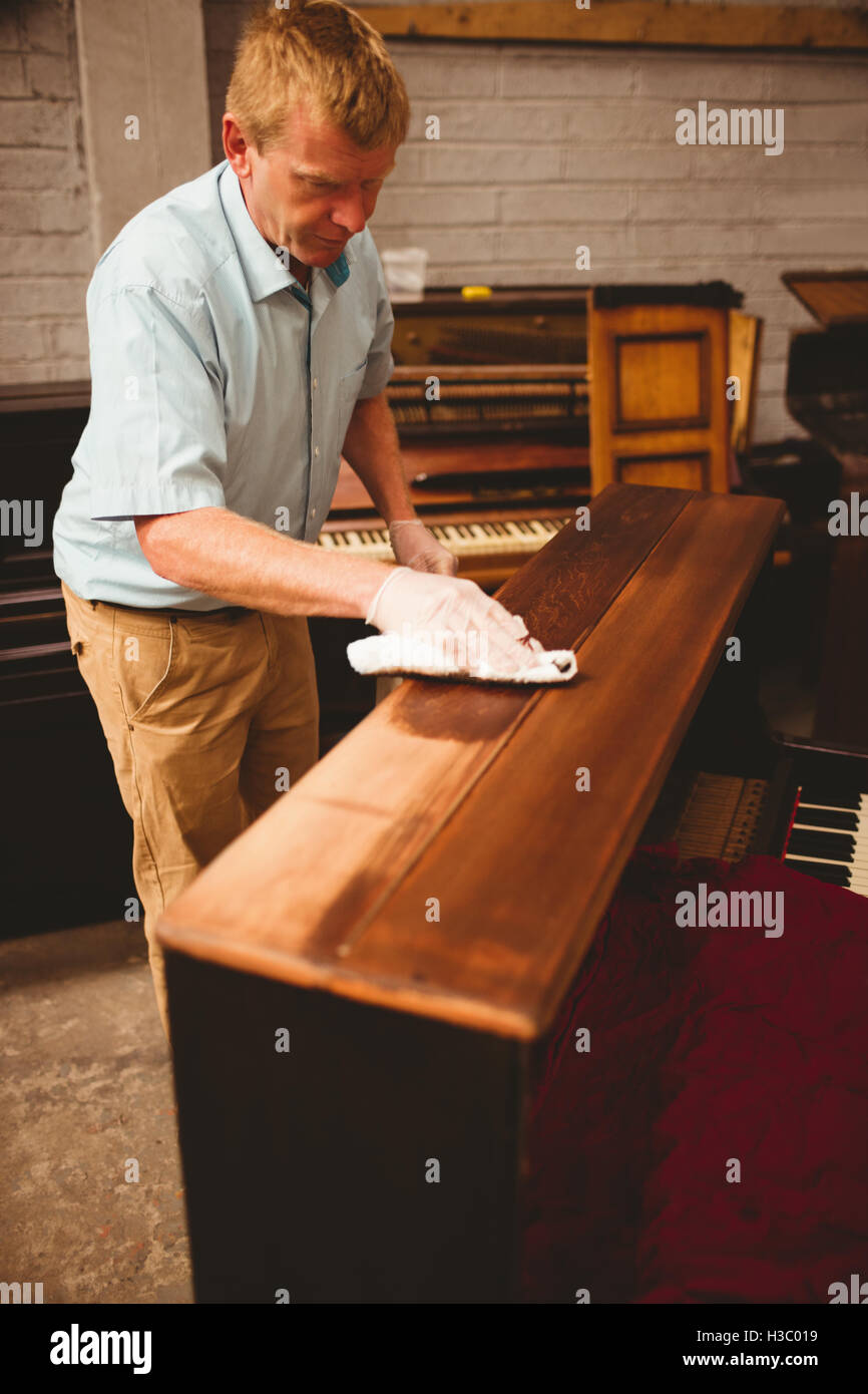 Piano technician repairing the piano Stock Photo - Alamy
