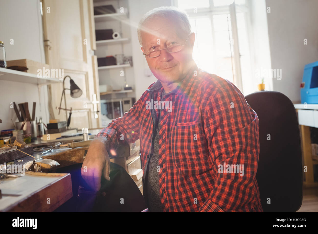 Portrait of smiling goldsmith Stock Photo - Alamy