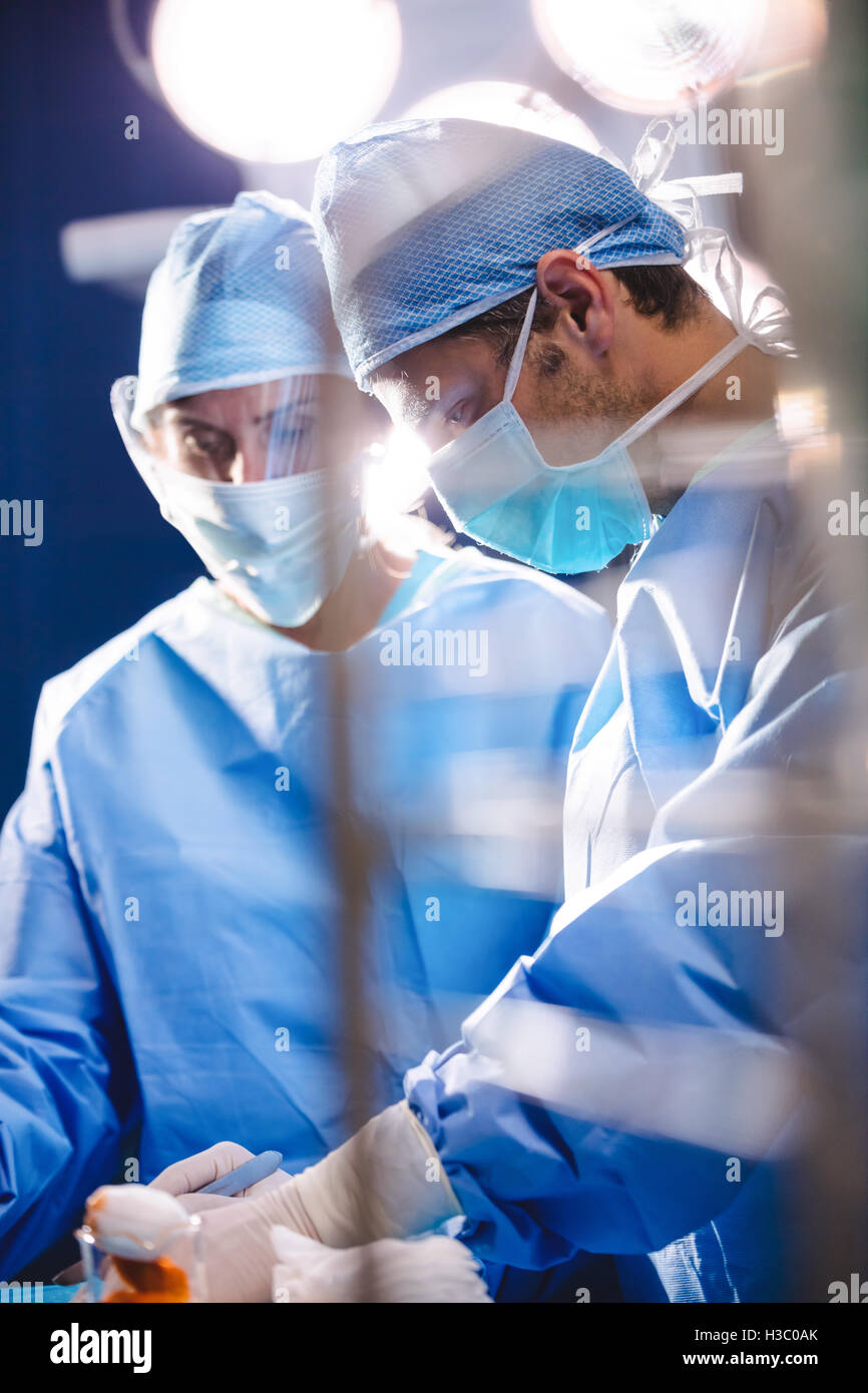 Surgeons performing operation in operation room Stock Photo - Alamy