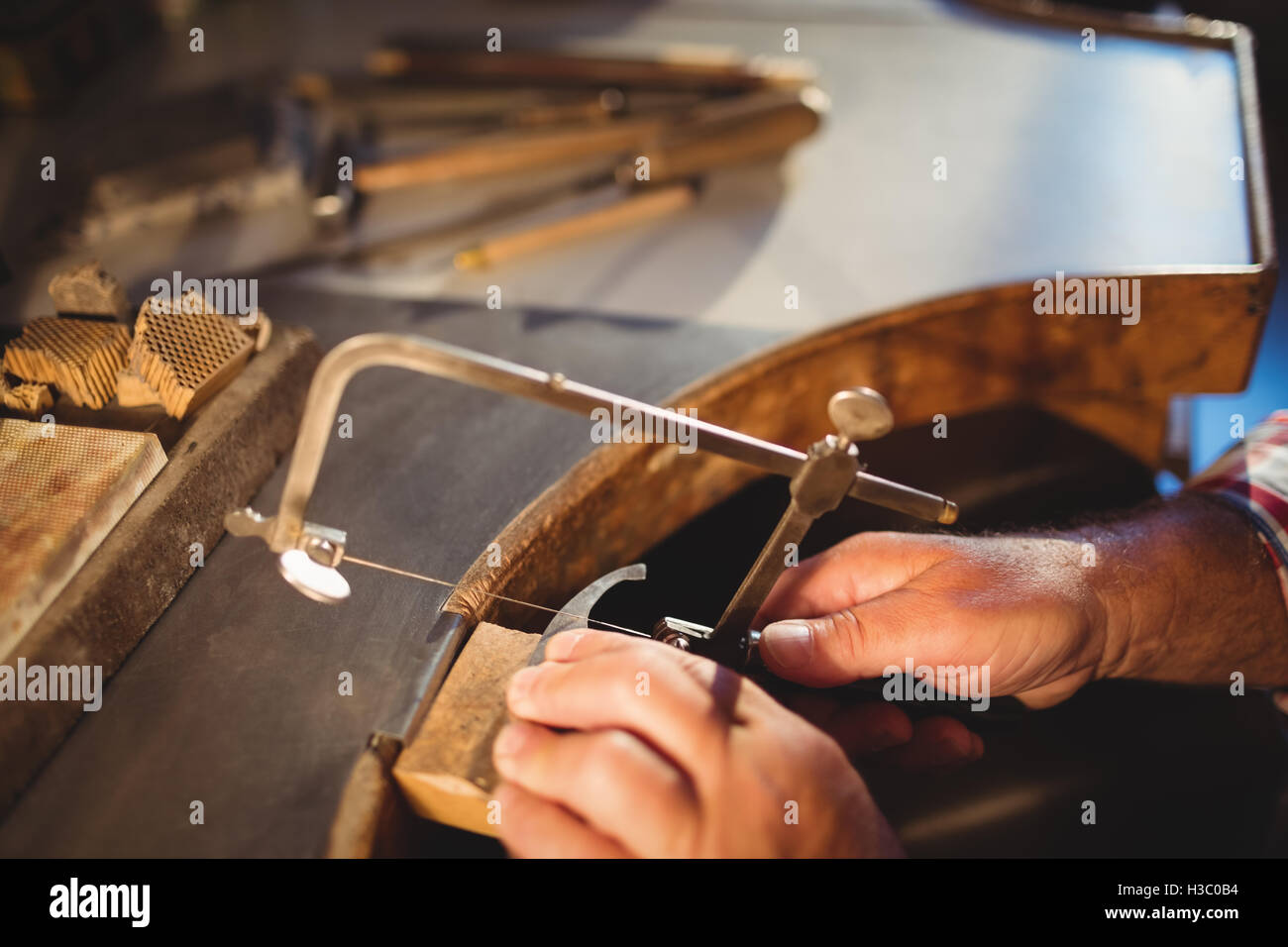 Goldsmith working with saw hi-res stock photography and images - Alamy