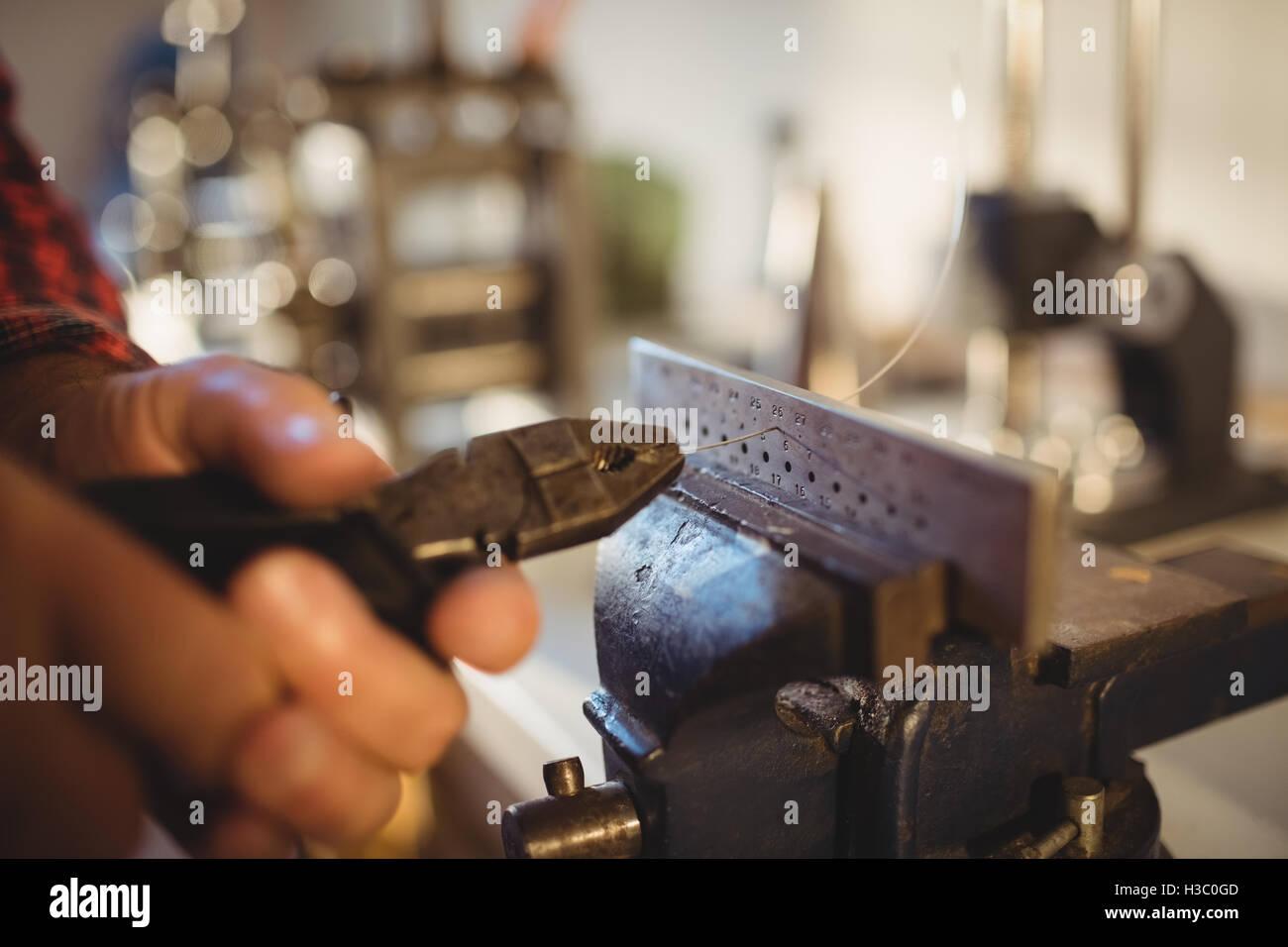 Goldsmith working in workshop Stock Photo - Alamy