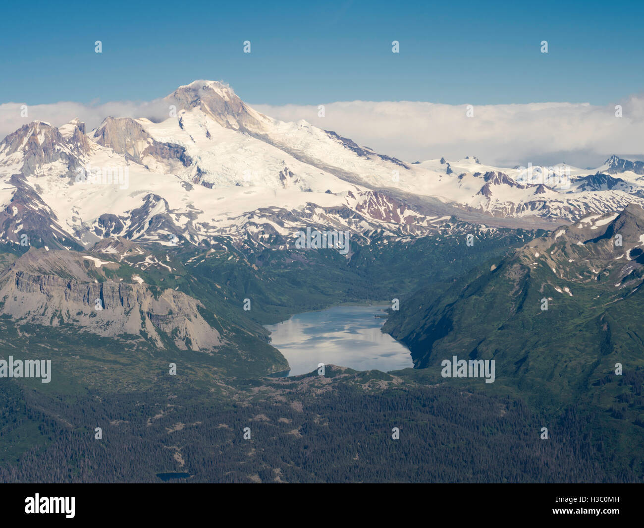 Aerial view of the Iliamna Volcano and Hickerson Lake in the foreground ...