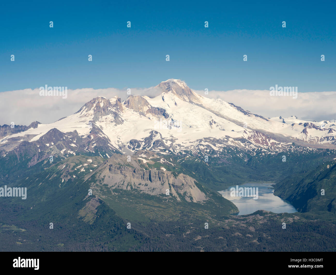 Aerial view of the Iliamna Volcano and Hickerson Lake in the foreground ...