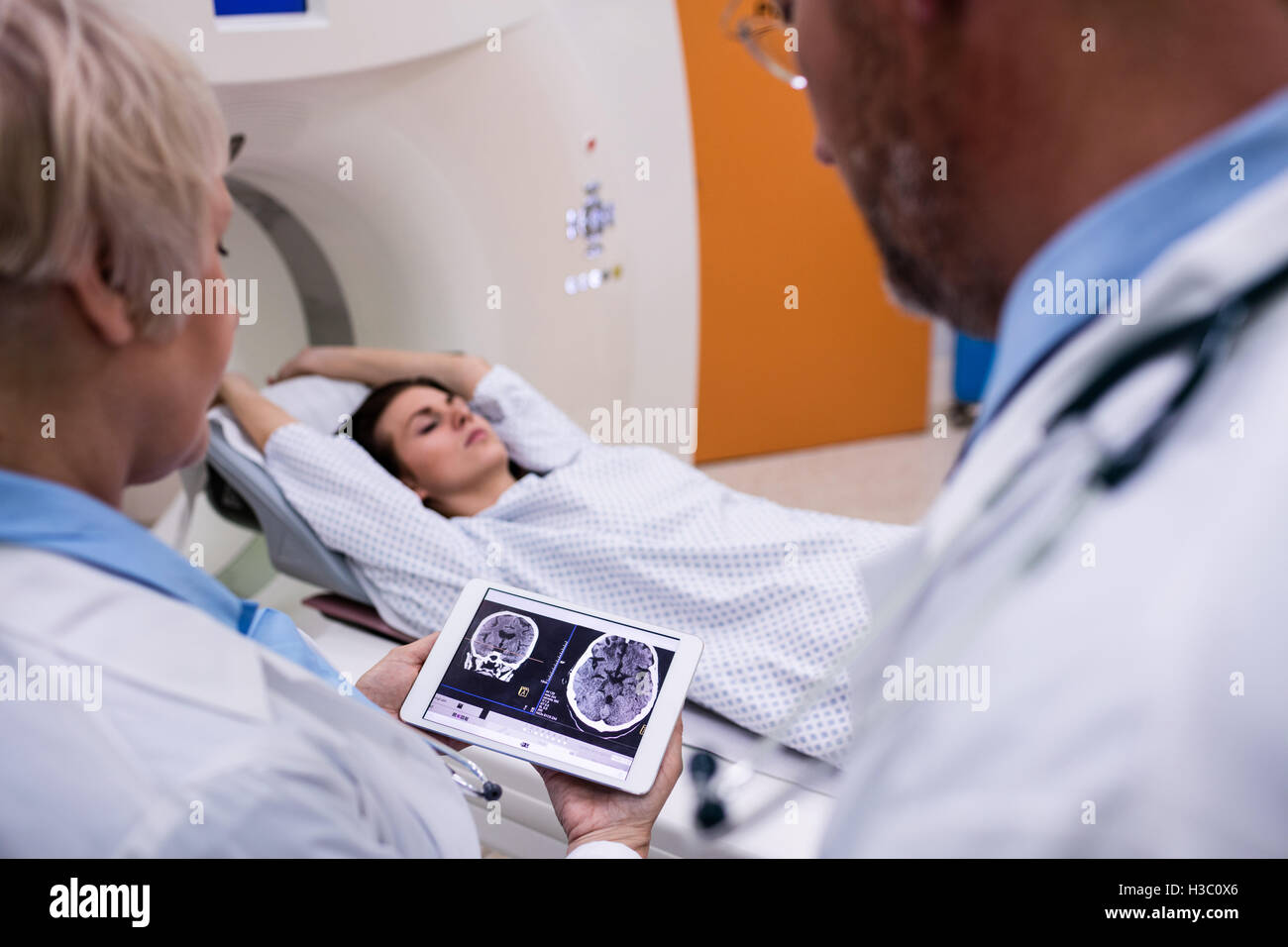 Doctors examining brain mri scan on digital tablet Stock Photo - Alamy
