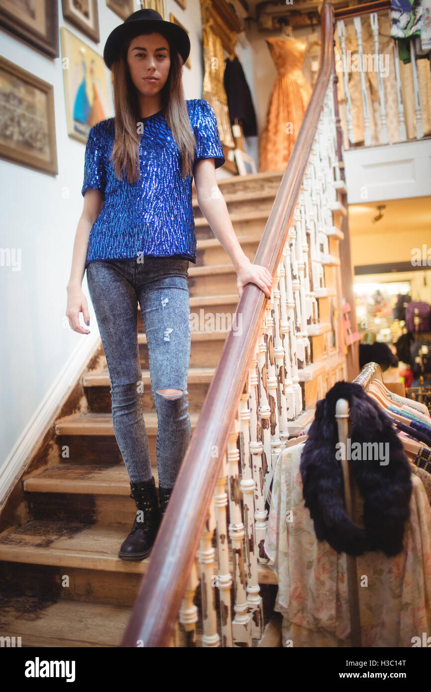 Portrait of female staff standing on staircase Stock Photo - Alamy