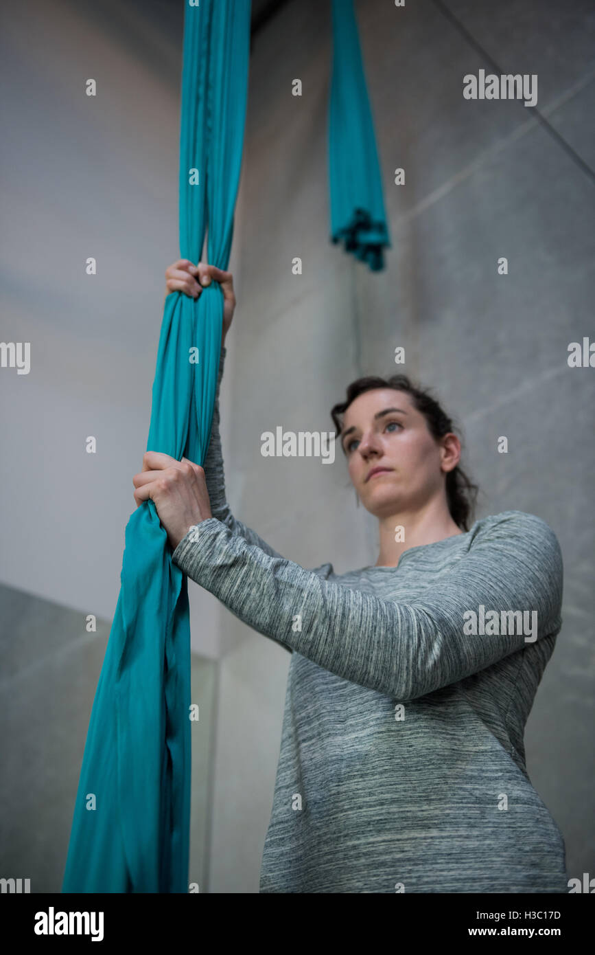 Gymnast holding fabric rope Stock Photo - Alamy