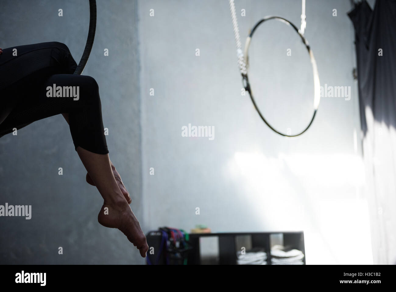 Gymnast balancing on hoop Stock Photo - Alamy