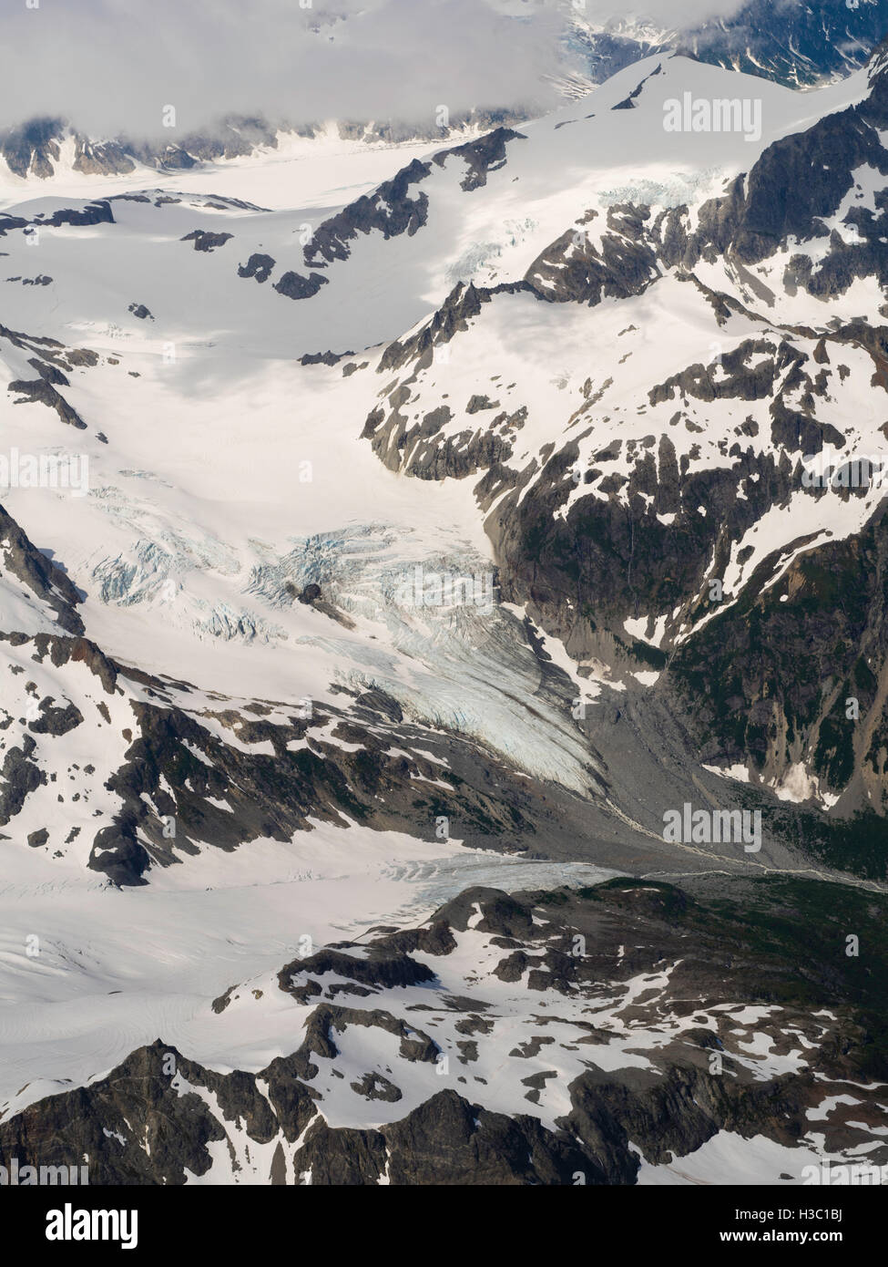 Aerial view of mountains, snow and glaciers, Lake Clark National Park ...