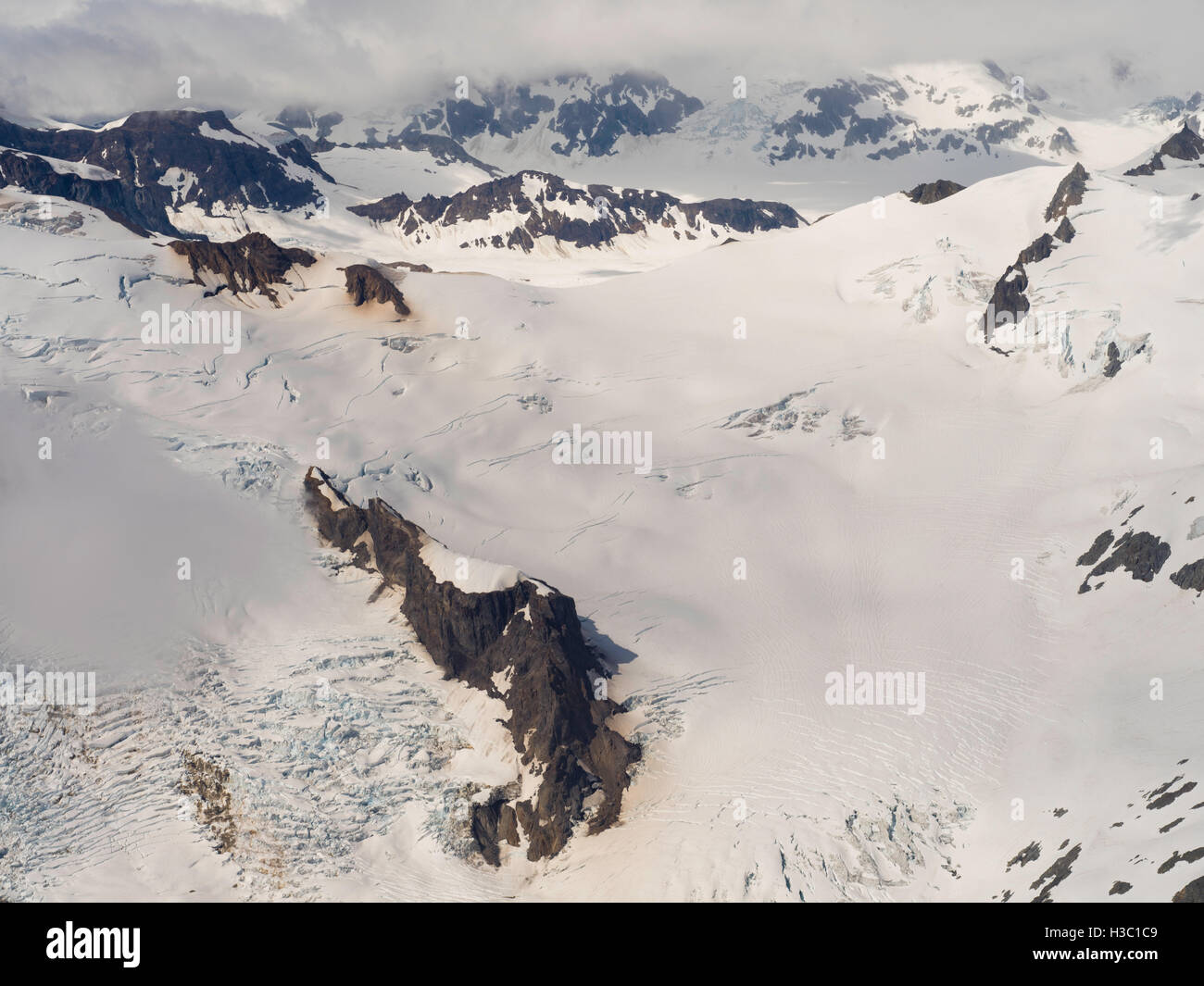 Aerial view of mountains, snow and glaciers, Lake Clark National Park ...