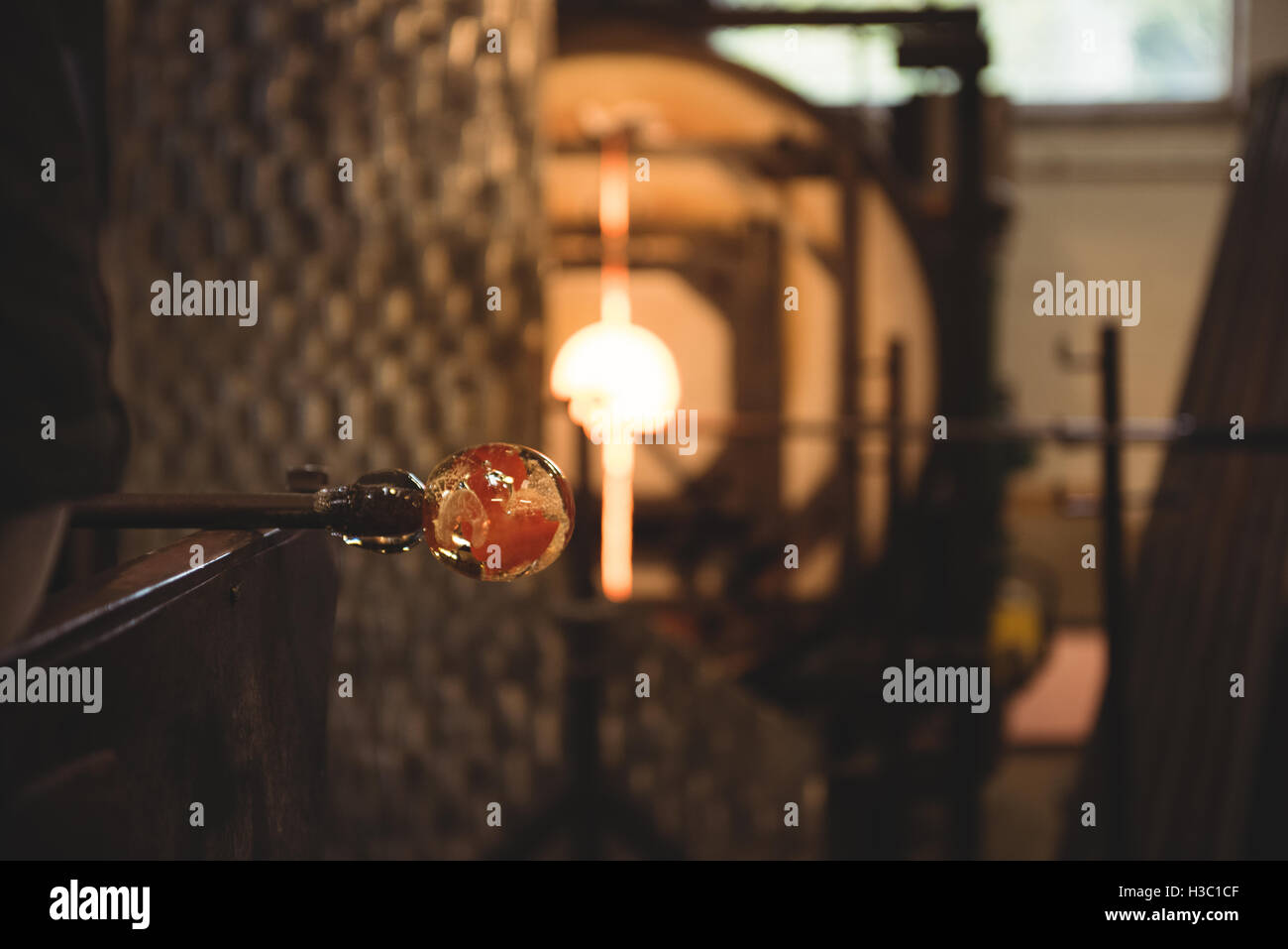 Close-up of molten glass on a blowpipe Stock Photo - Alamy