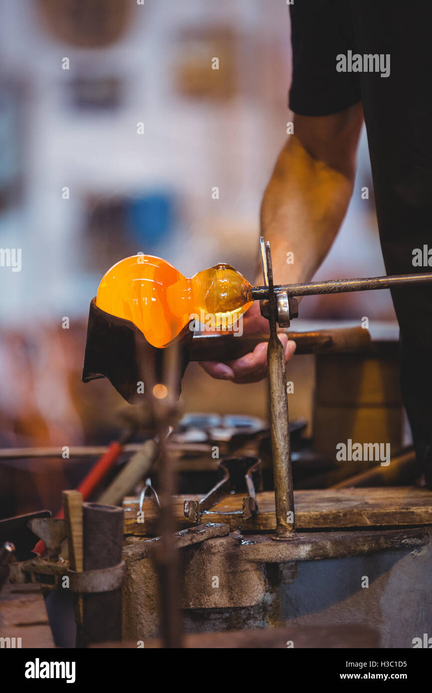 Glassblower forming and shaping a molten glass Stock Photo - Alamy