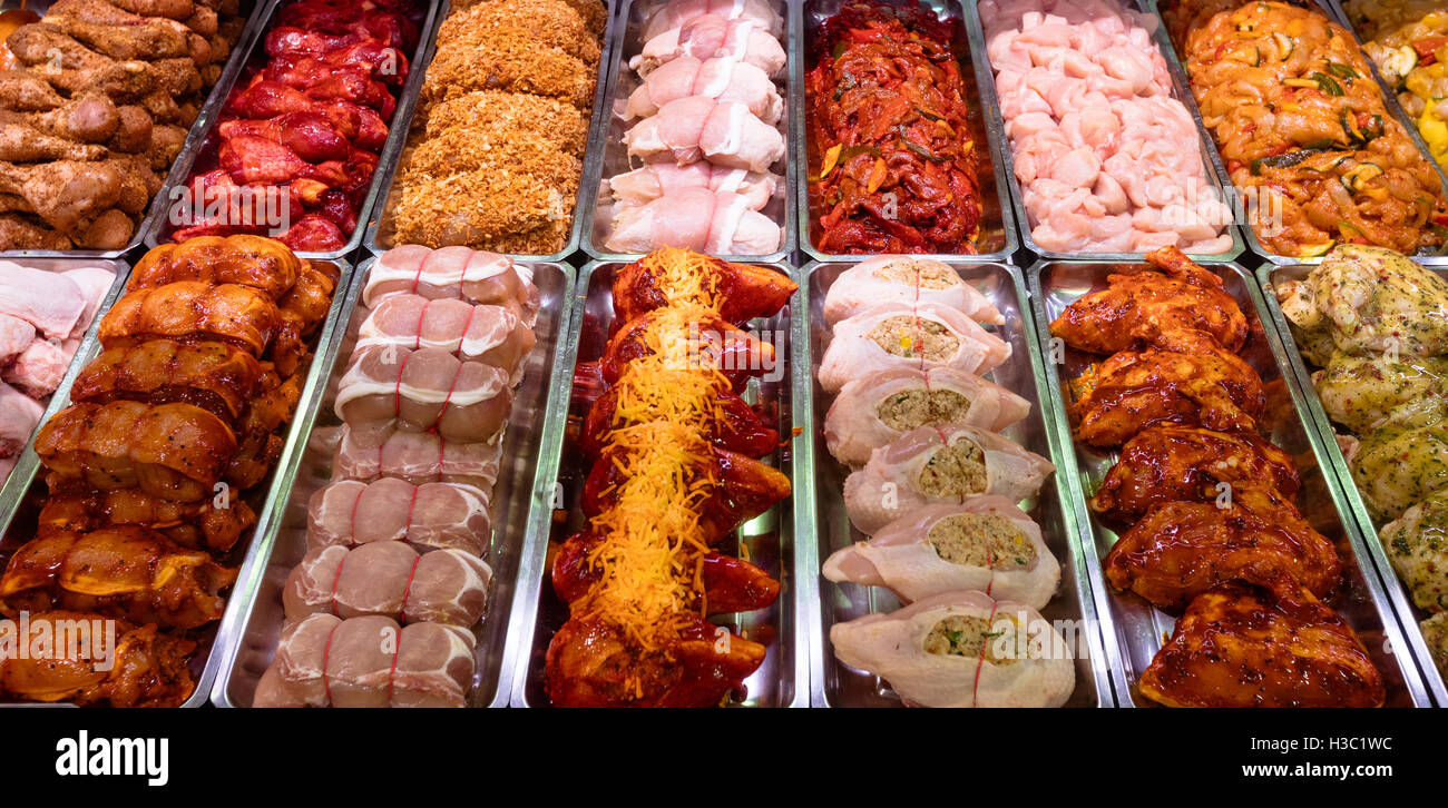 Variety of marinated meat at display counter Stock Photo - Alamy