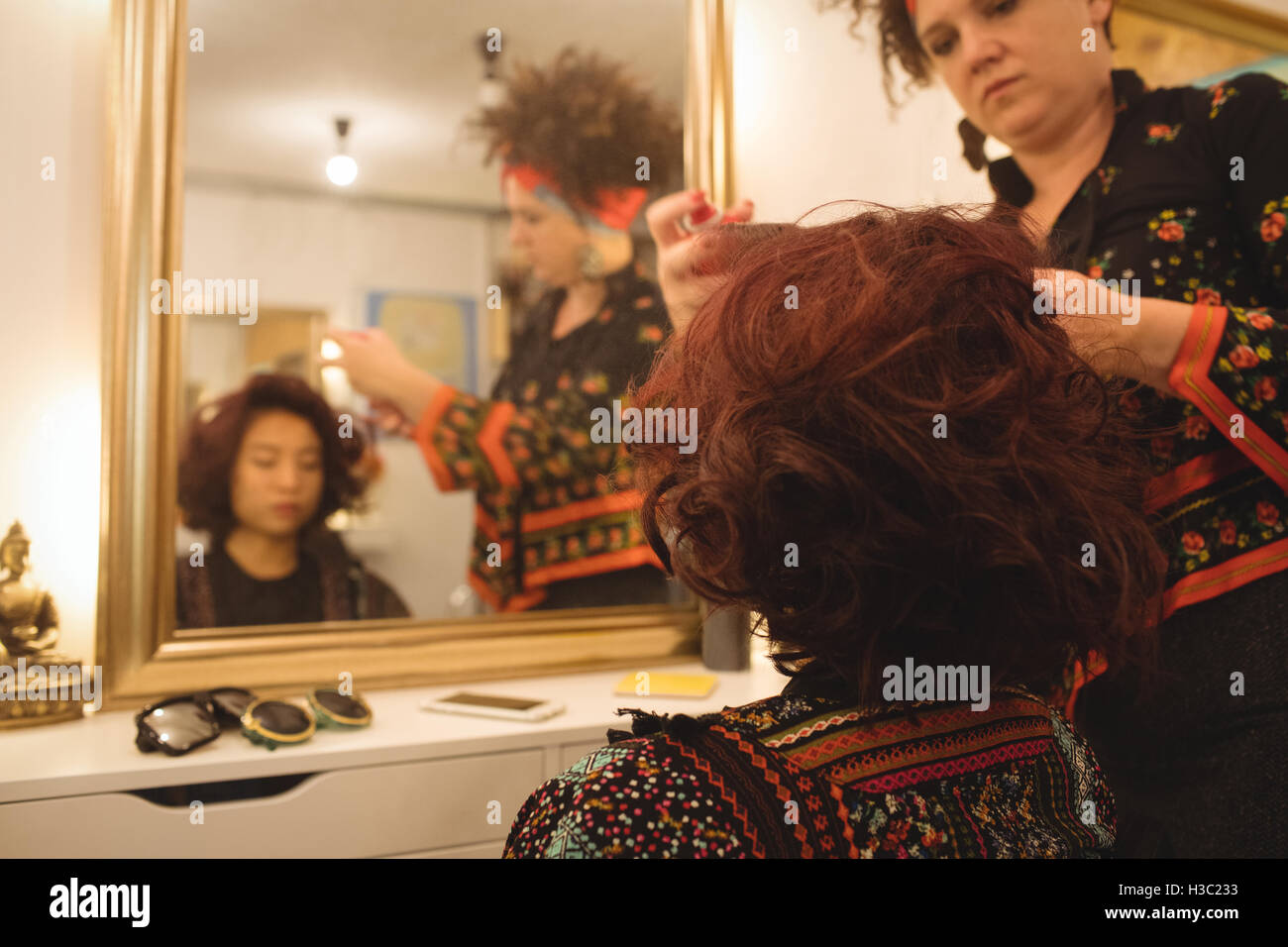 Stylish woman getting her hair done Stock Photo - Alamy