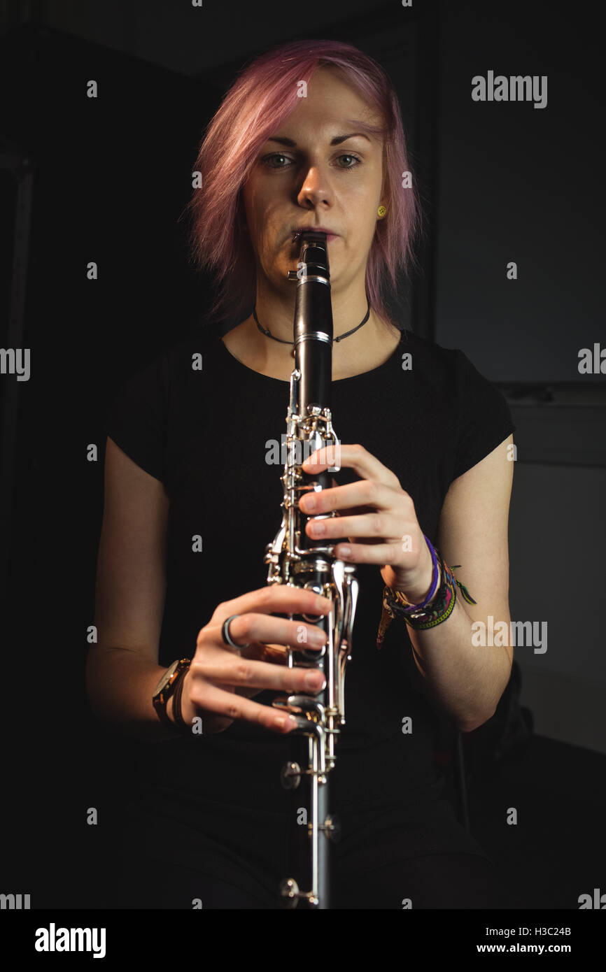 Woman playing a clarinet in music school Stock Photo - Alamy