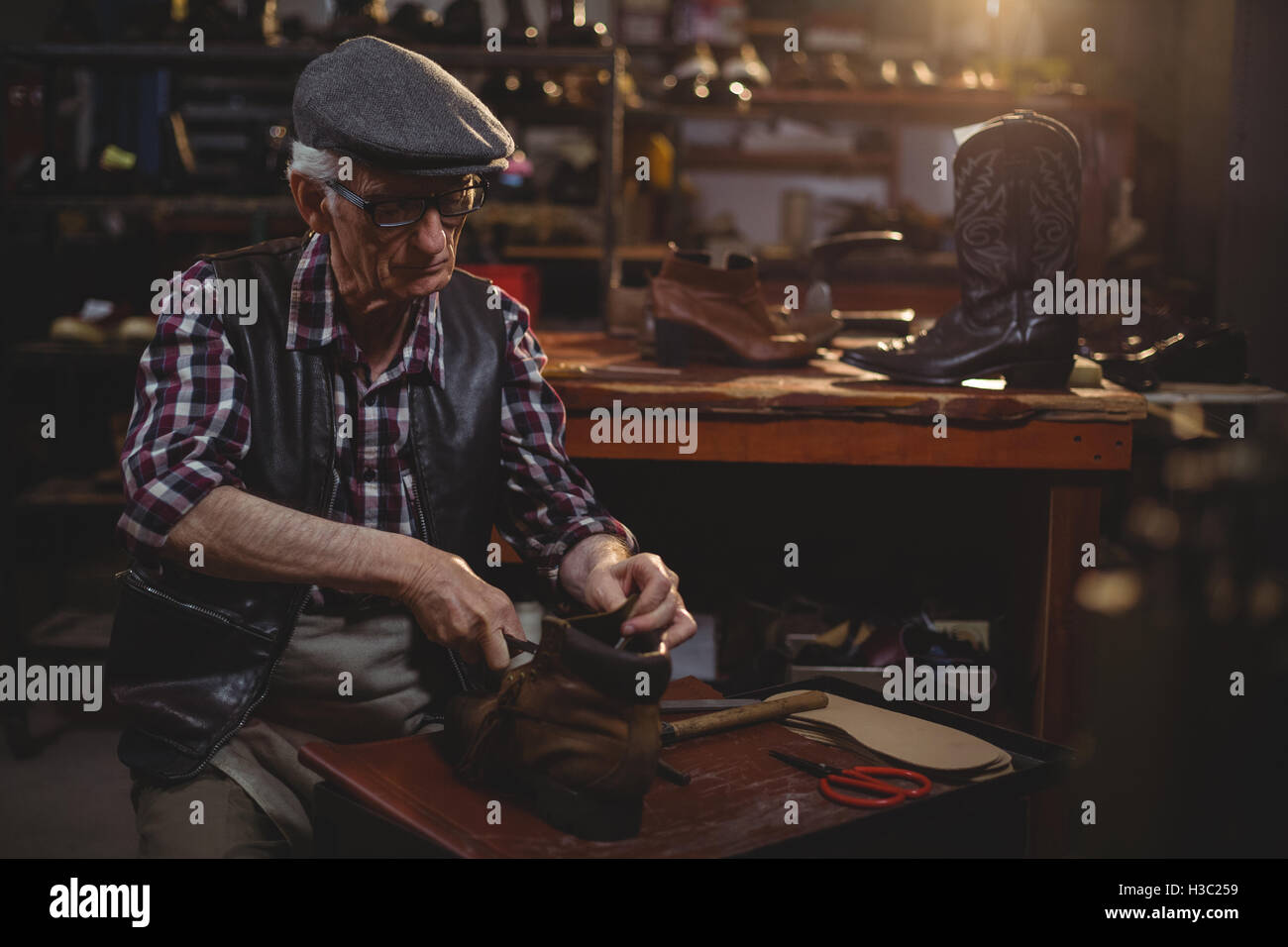Shoemaker hi-res stock photography and images - Alamy