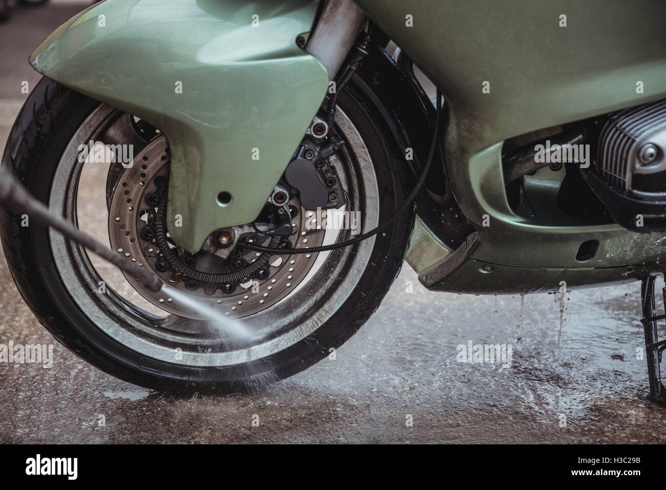 Motorcycle washing at workshop Stock Photo - Alamy
