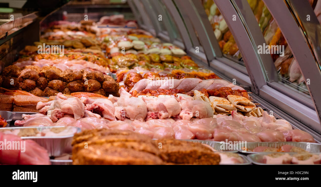 Variety of marinated meat at display counter Stock Photo - Alamy