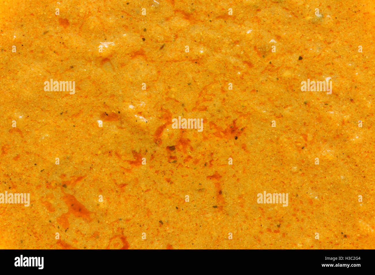 yellow curry sauce texture background #2 Stock Photo - Alamy