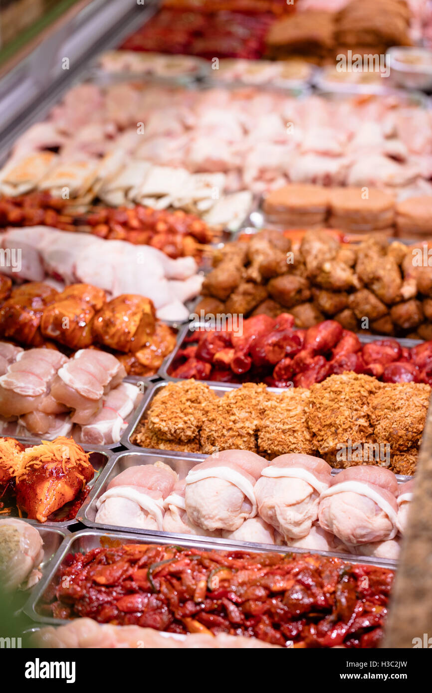 Variety of marinated meat at display counter Stock Photo - Alamy