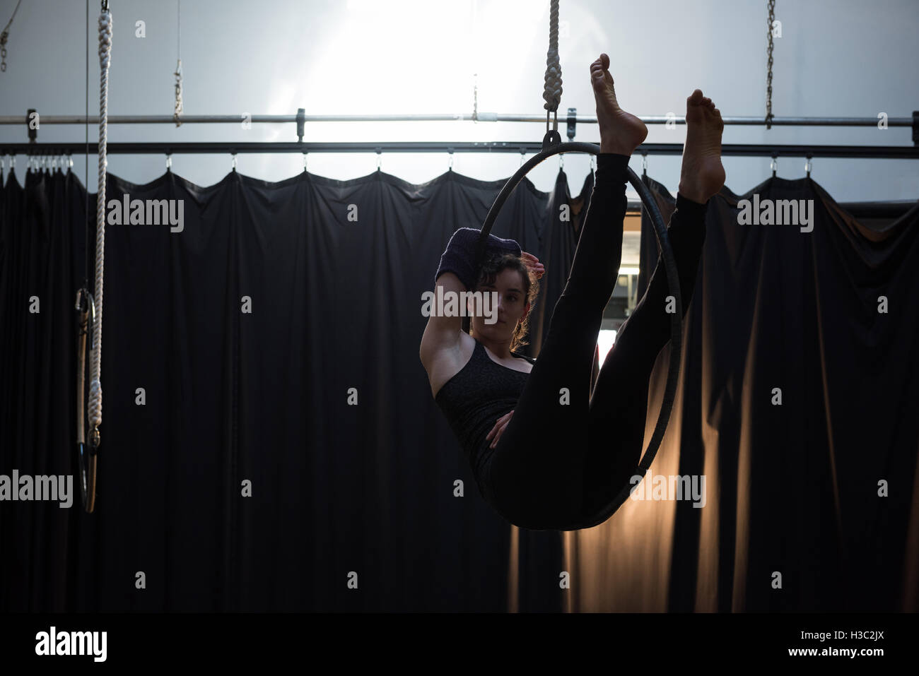 Gymnast performing gymnastics on hoop Stock Photo - Alamy
