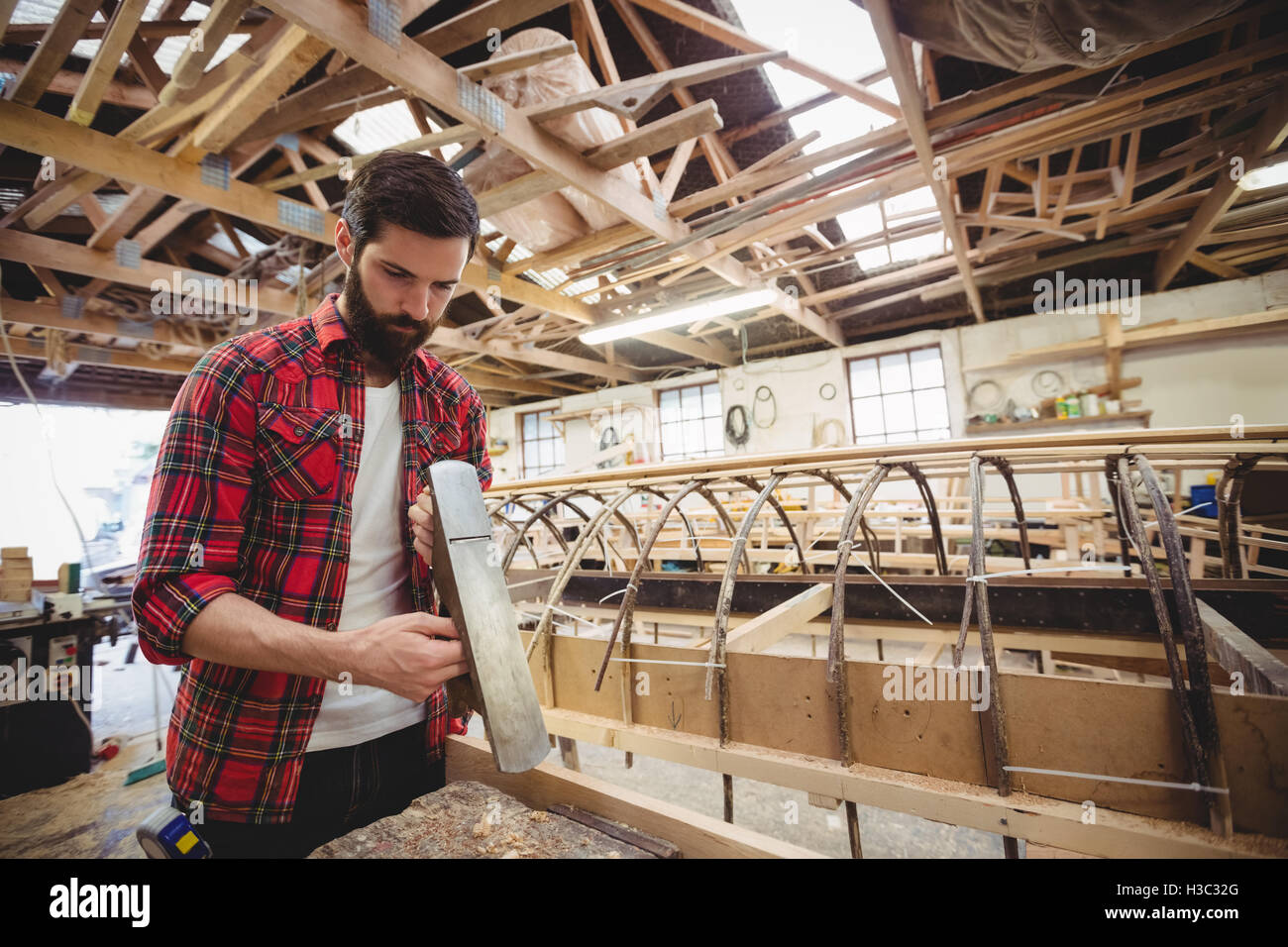 Man adjusting a hand plane Stock Photo - Alamy