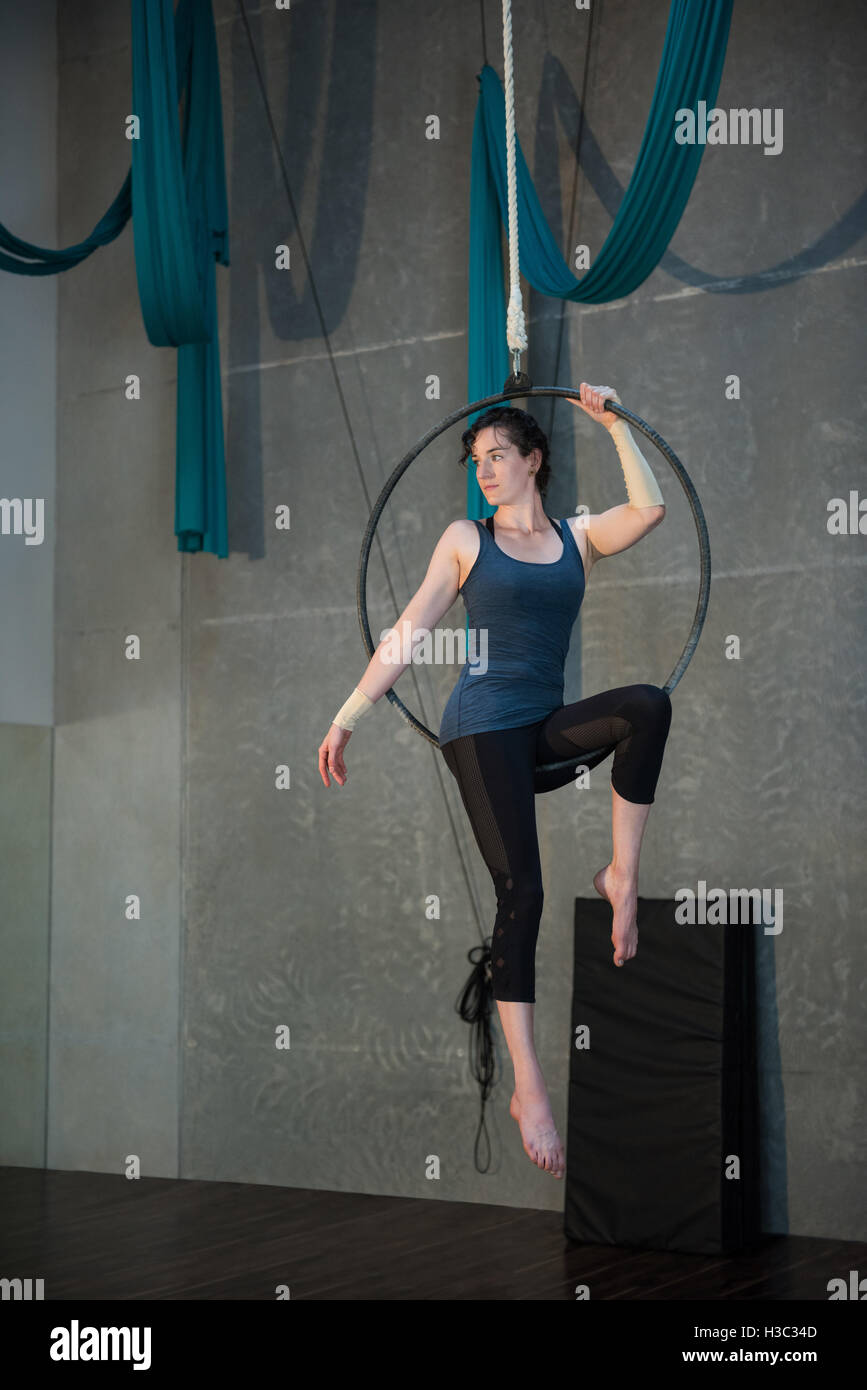 Gymnast performing gymnastics on hoop Stock Photo - Alamy