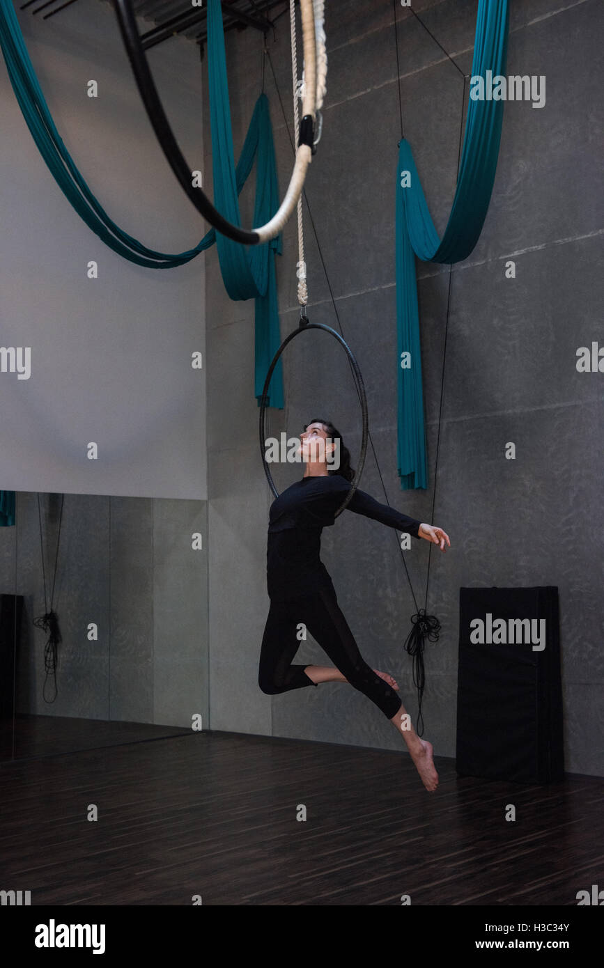 Gymnast performing gymnastics on hoop Stock Photo - Alamy