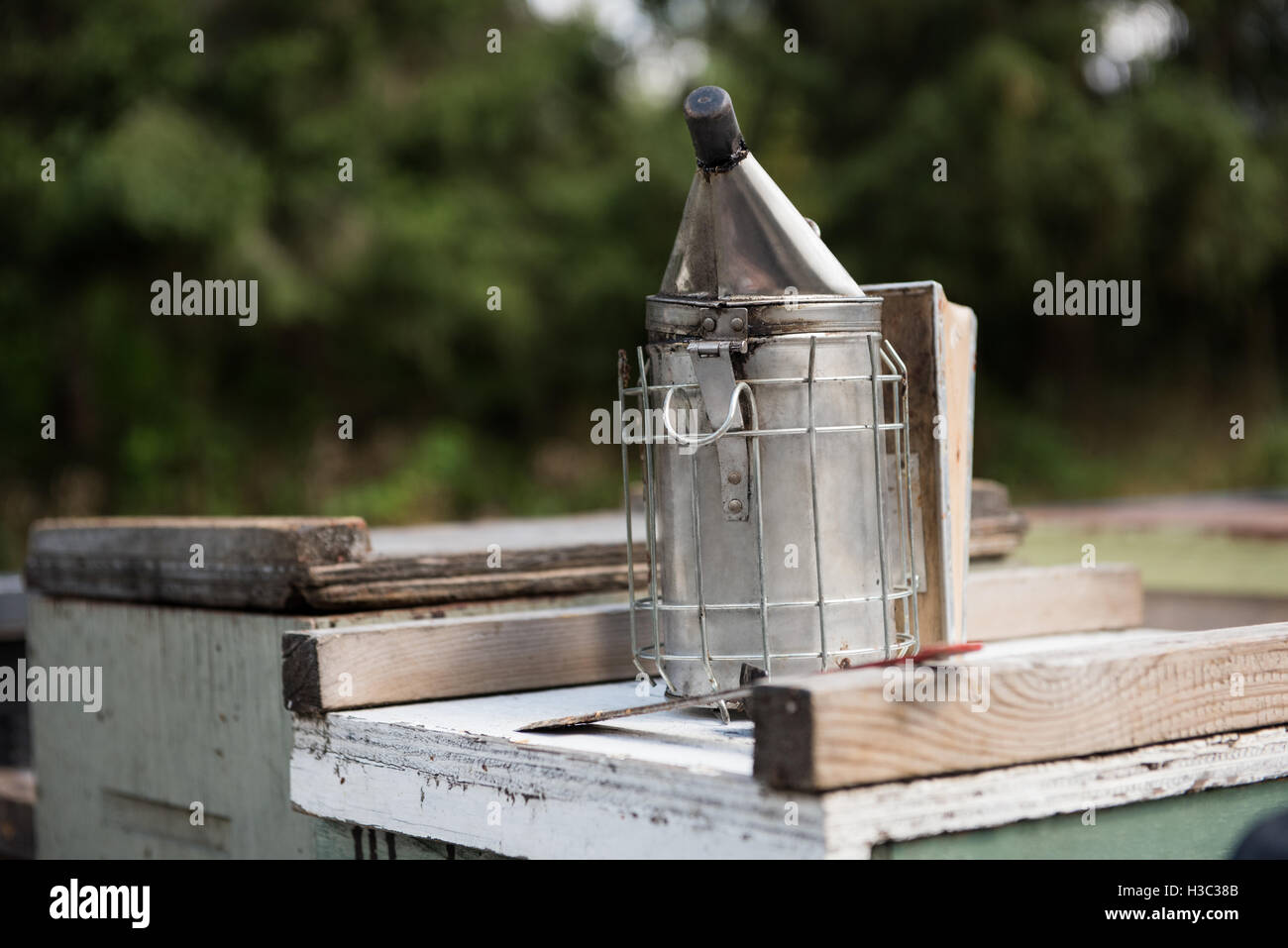 Bee smoker on wooden box Stock Photo - Alamy