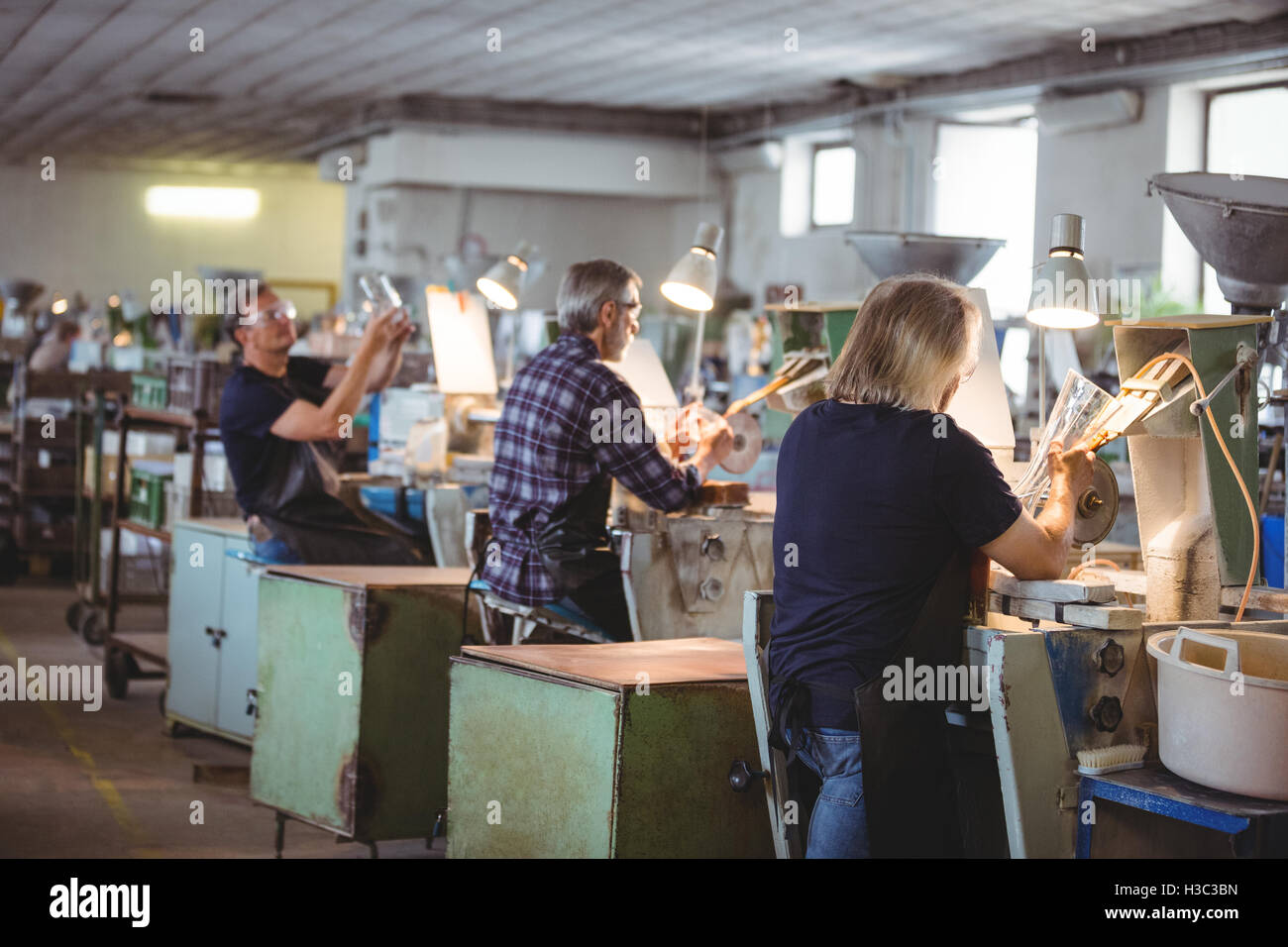 Glassblowers working on a glass Stock Photo - Alamy