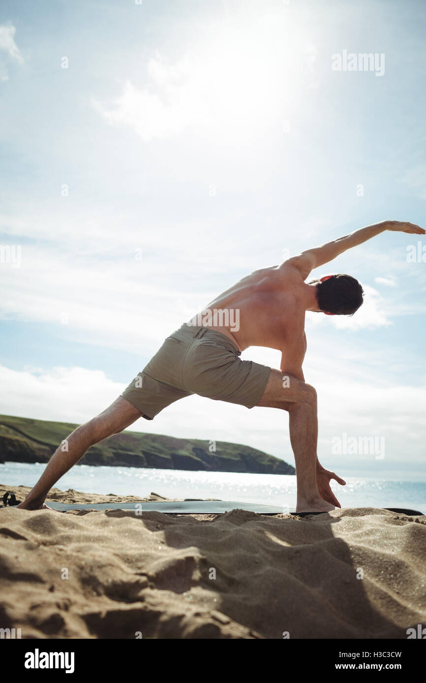 Man performing stretching exercise Stock Photo - Alamy