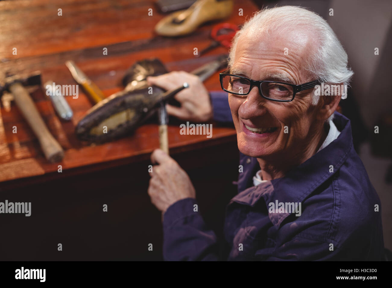 Happy shoemaker smiling camera making hi-res stock photography and ...