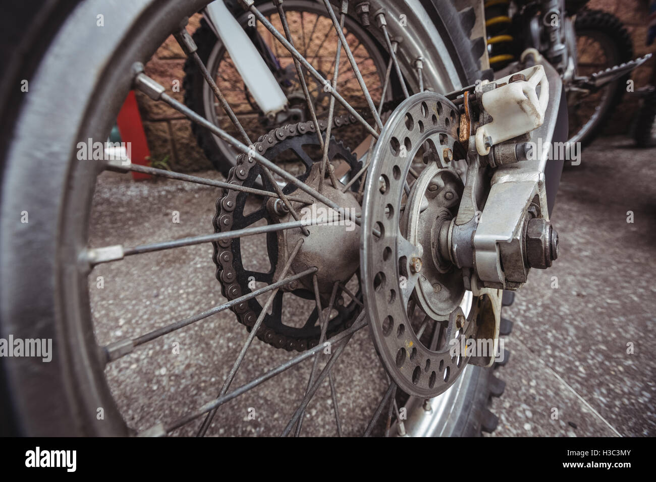 Motorbike wheel in workshop Stock Photo - Alamy