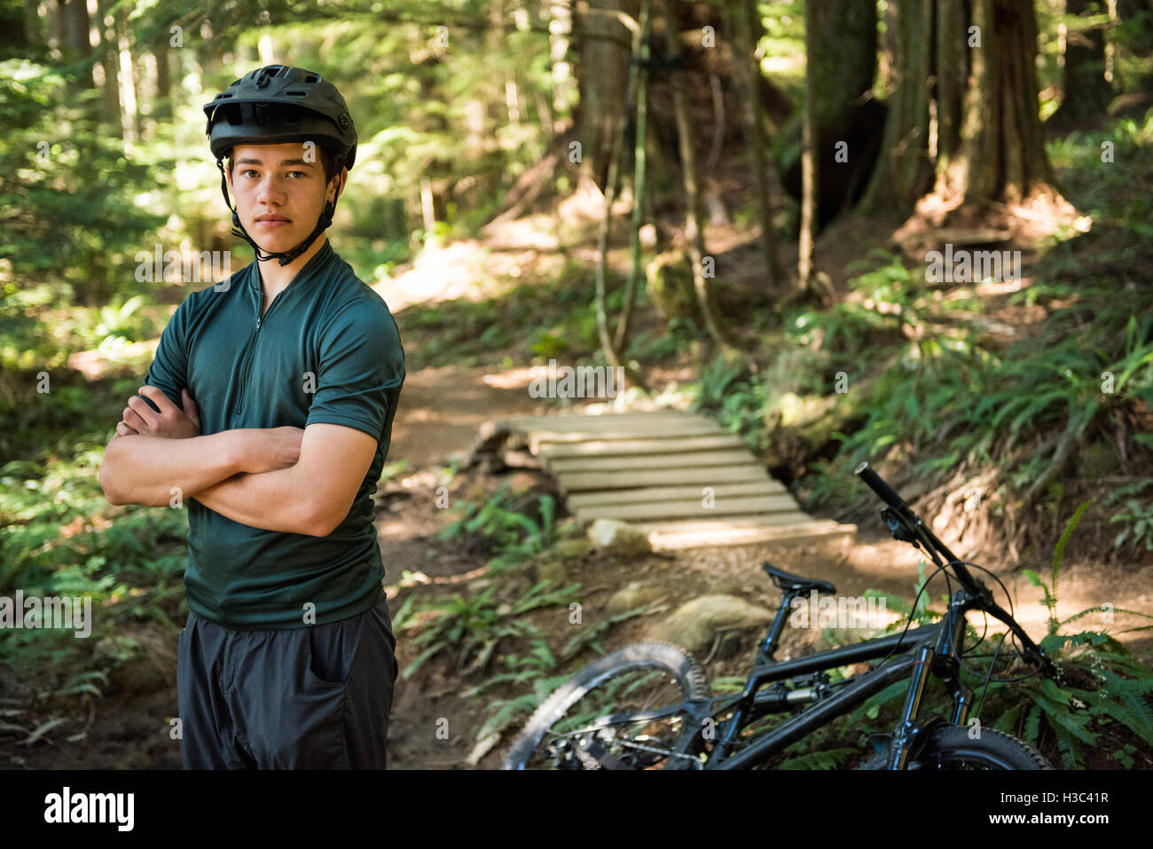 Biker with crossed arms helmet hi-res stock photography and images - Alamy