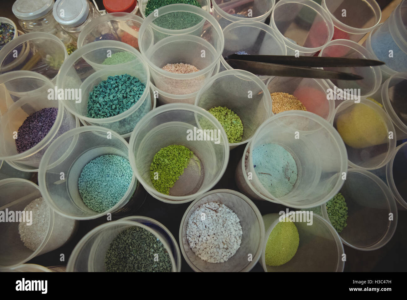 Close-up of frit glass in plastic container Stock Photo - Alamy
