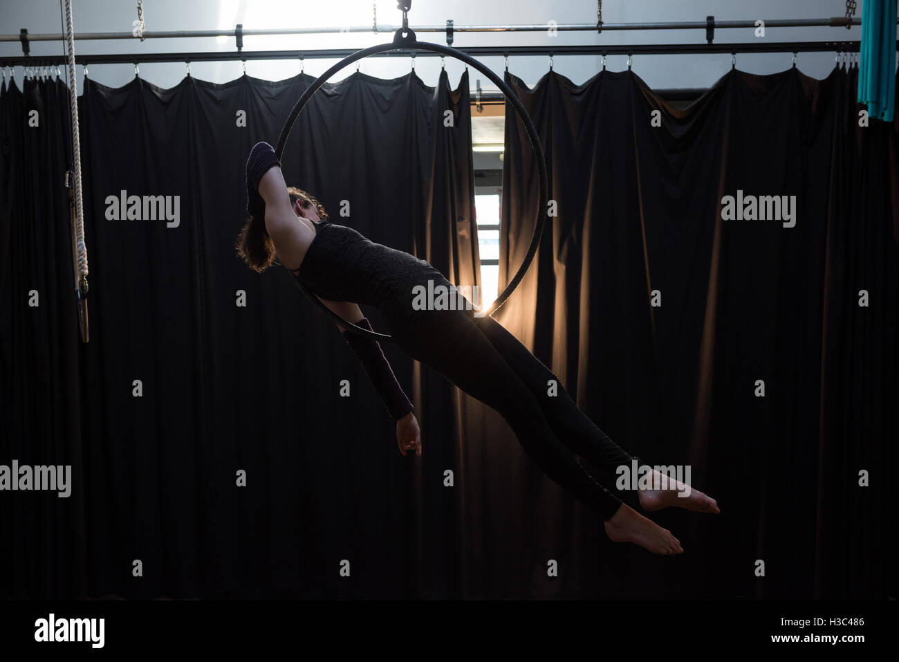 Gymnast performing gymnastics on hoop Stock Photo - Alamy