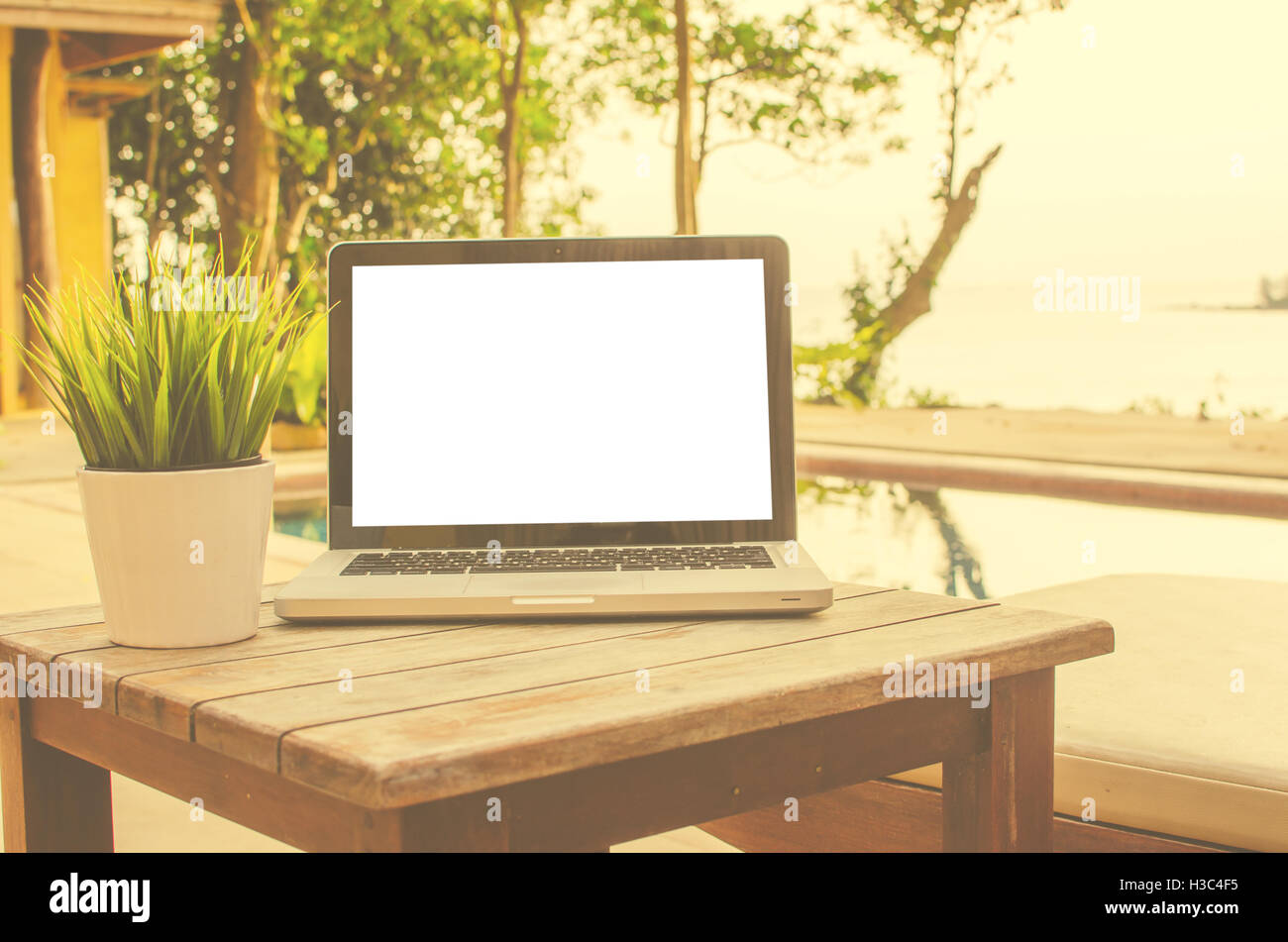 computer on table background as a pool. filter vintage Stock Photo - Alamy