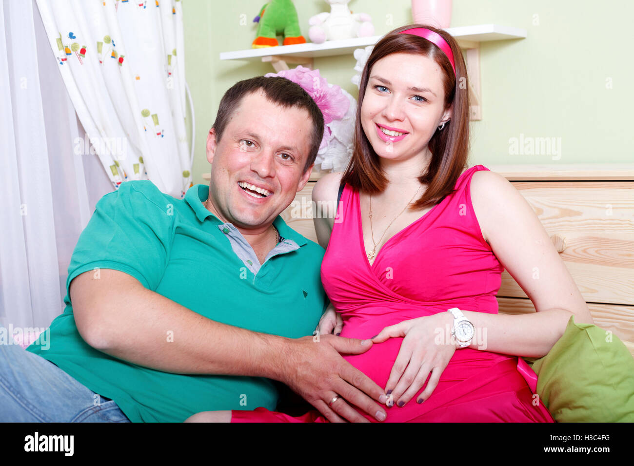 Happy parents waiting for baby hi-res stock photography and images - Alamy