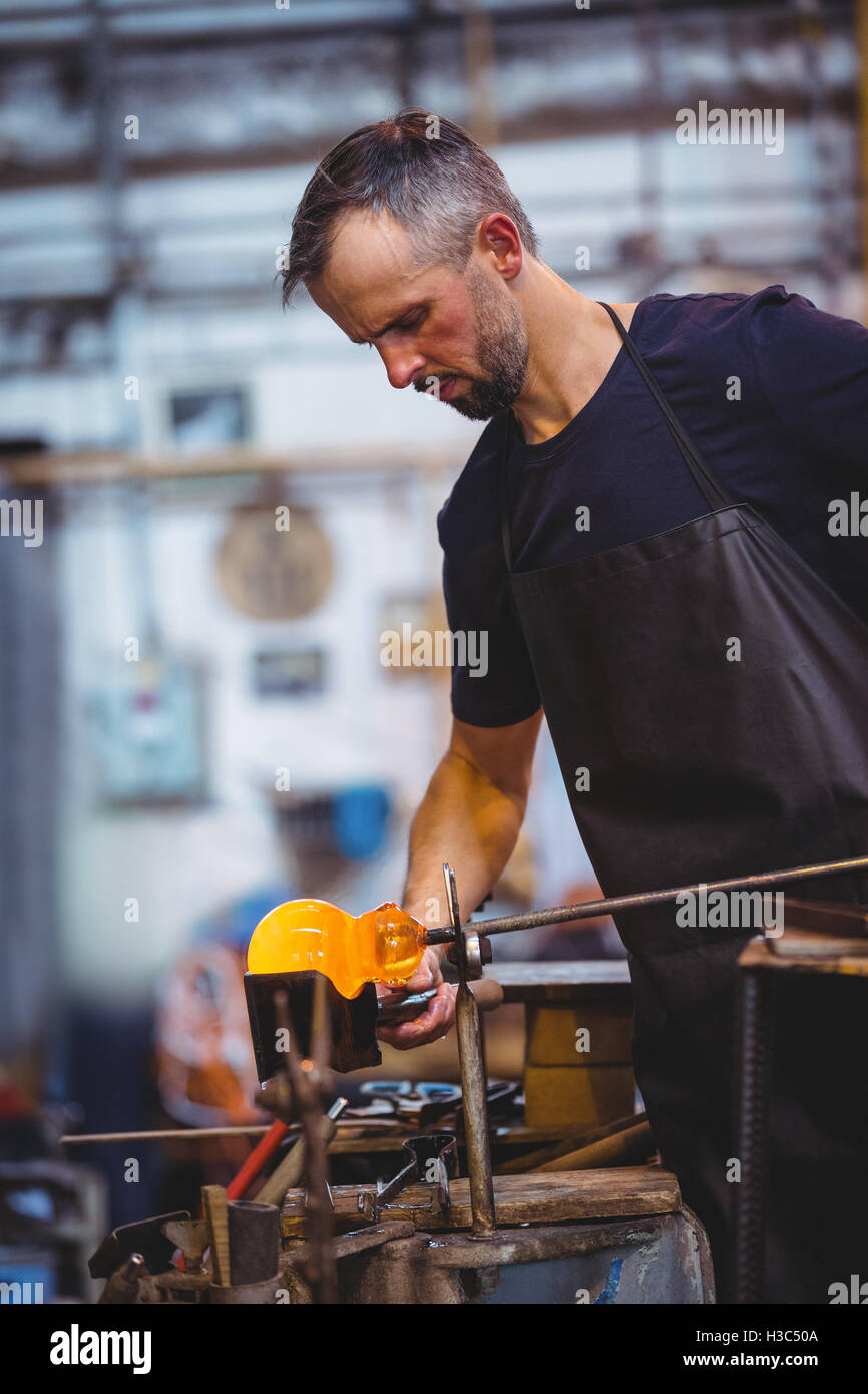 Glassblower forming and shaping a molten glass Stock Photo - Alamy