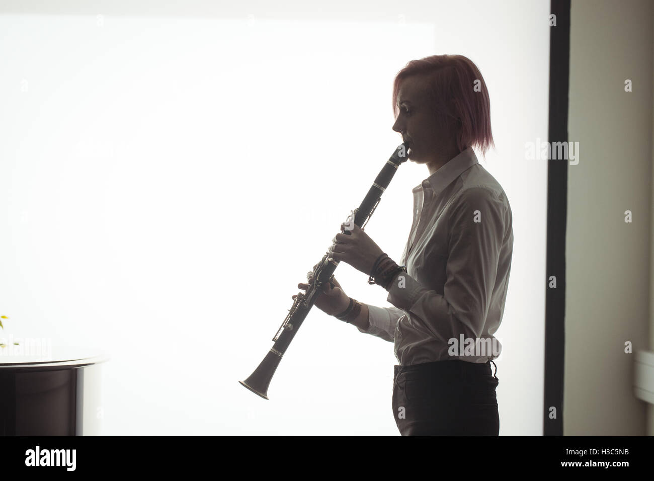 Woman playing a clarinet in music school Stock Photo - Alamy