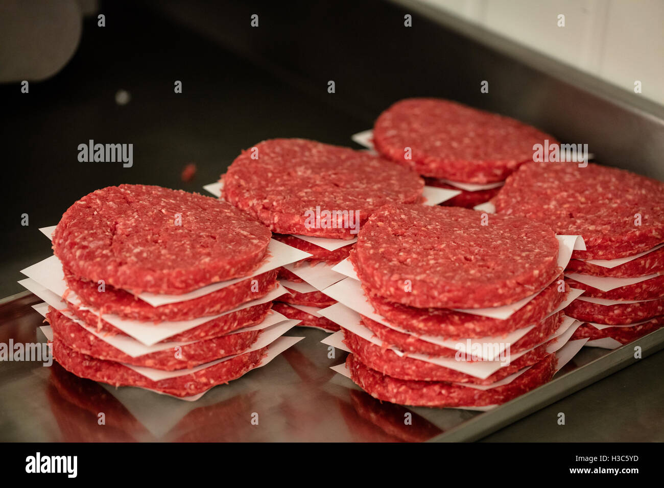 Raw hamburger patties in shop Stock Photo - Alamy