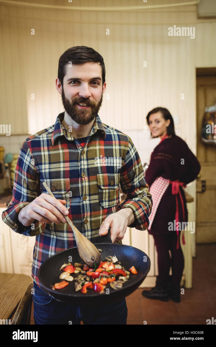 Man preparing food in kitchen Stock Photo - Alamy