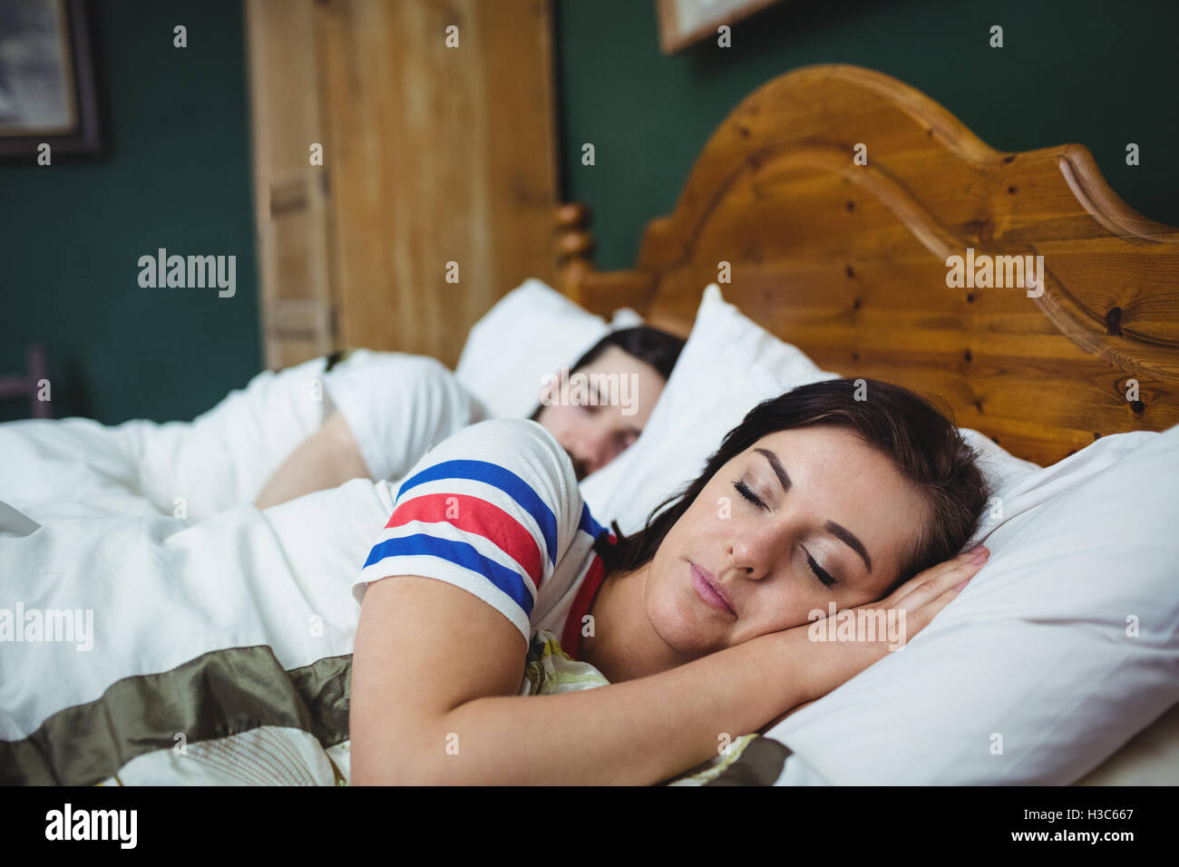 Couple sleeping together on bed Stock Photo - Alamy